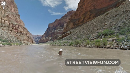 Cowboy swimming in Colorado River at Grand Canyon - STREETVIEWFUN