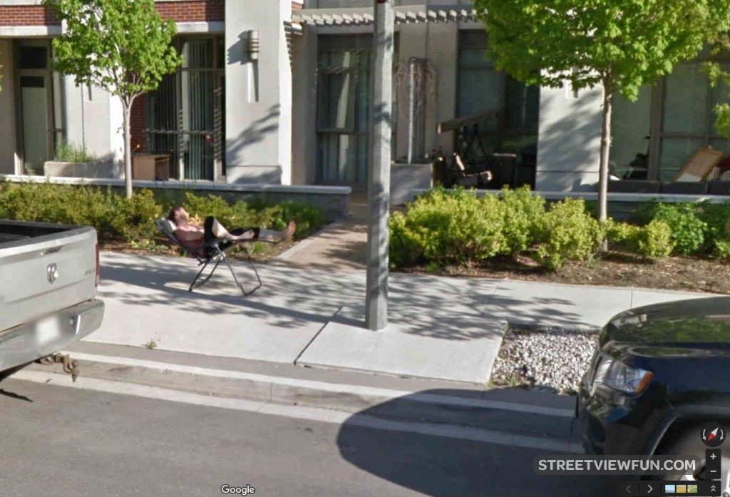 Dude sleeping on chair in middle of sidewalk – STREETVIEWFUN