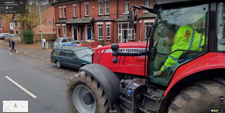 Picking something up while you are not looking where your going in your tractor - STREETVIEWFUN