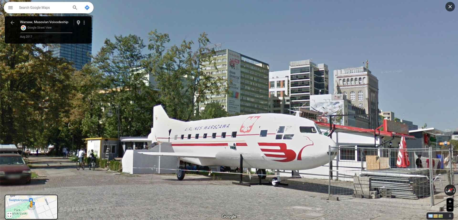 Very short winged plane in a parking lot - STREETVIEWFUN