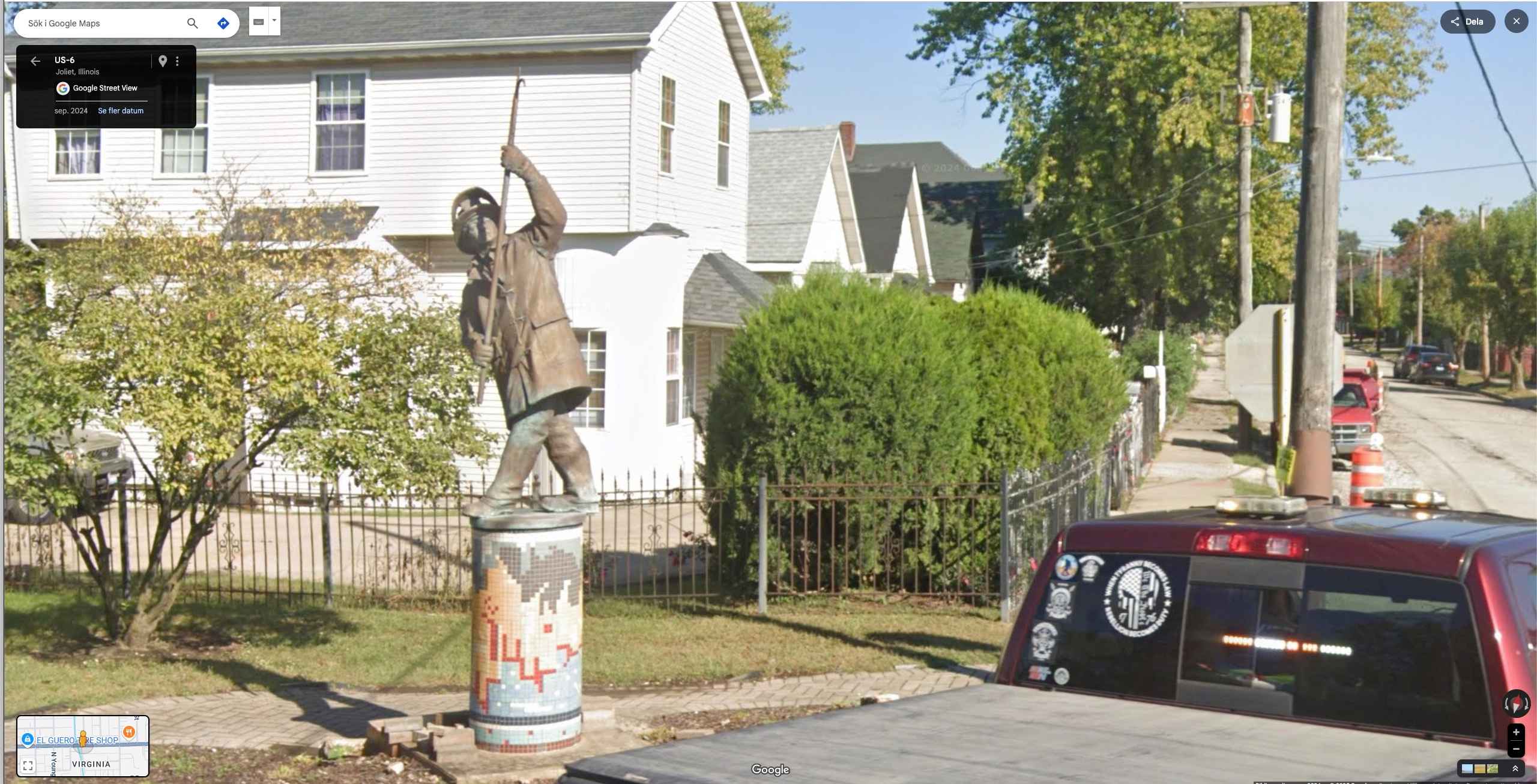 Statue of a man with stick - STREETVIEWFUN