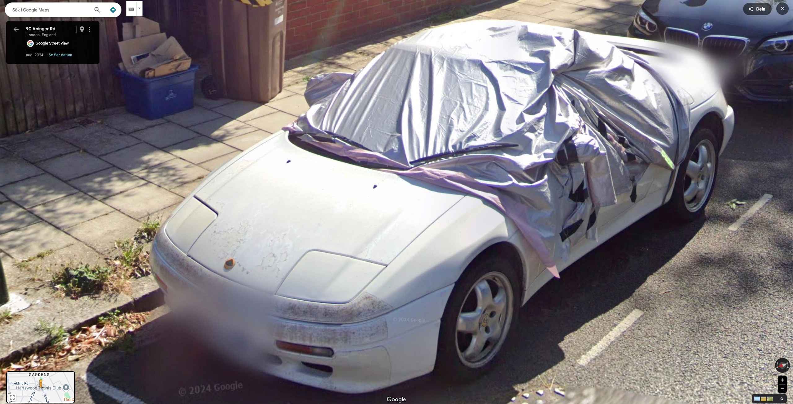 Half covered Lotus Elan - STREETVIEWFUN